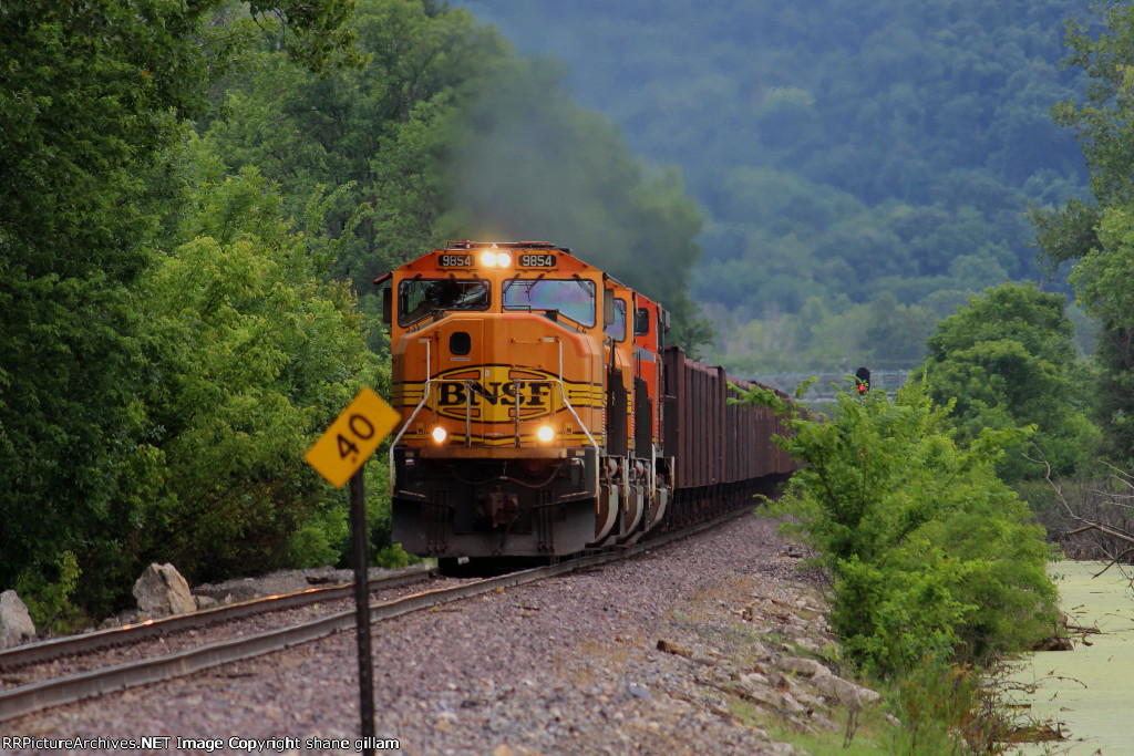 BNSF 9854 leads a empty tac train.